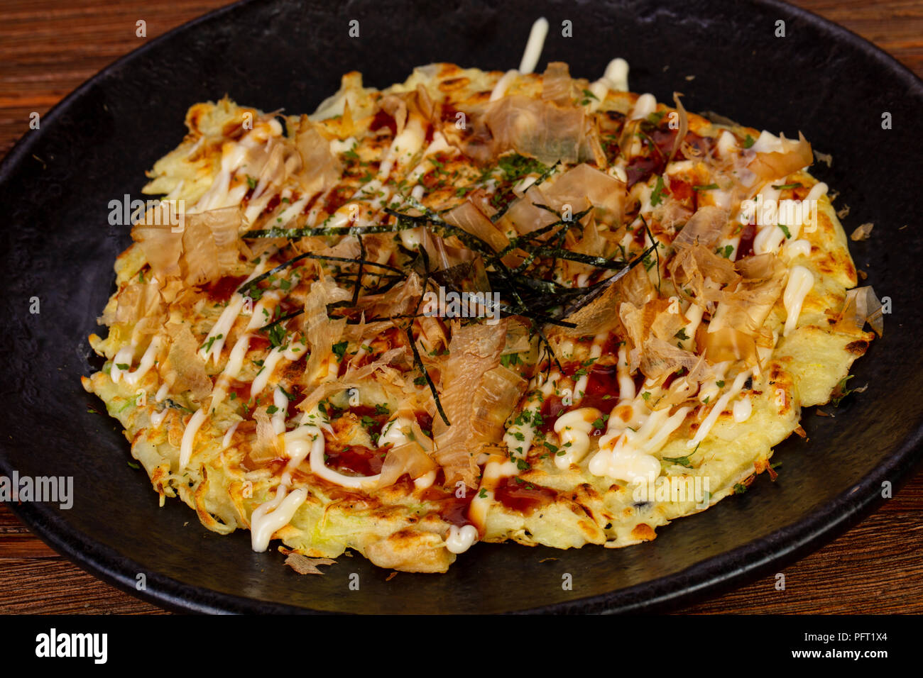 Japanese pizza with seafood and fish Stock Photo - Alamy