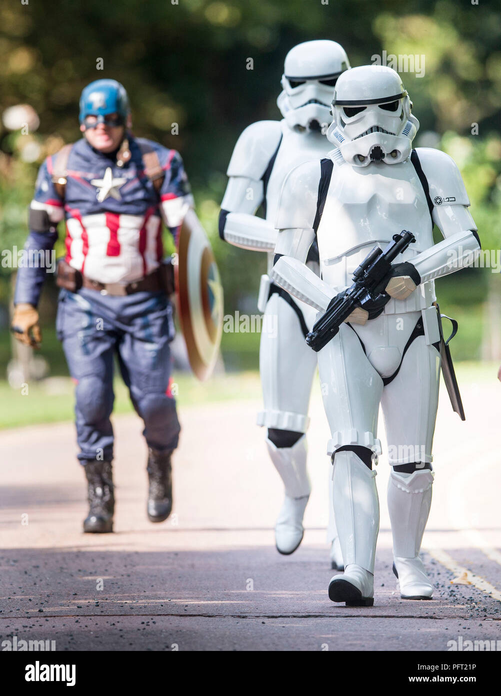 Mourners dressed as stormtroopers and superhero Captain America arrive ...