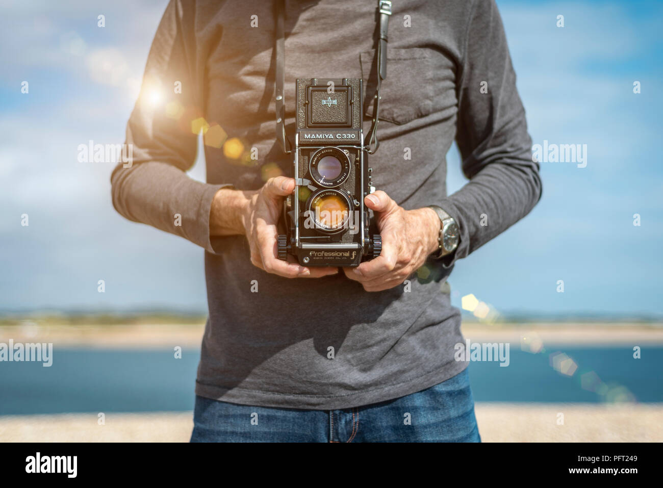 Old man holding camera hi-res stock photography and images - Alamy