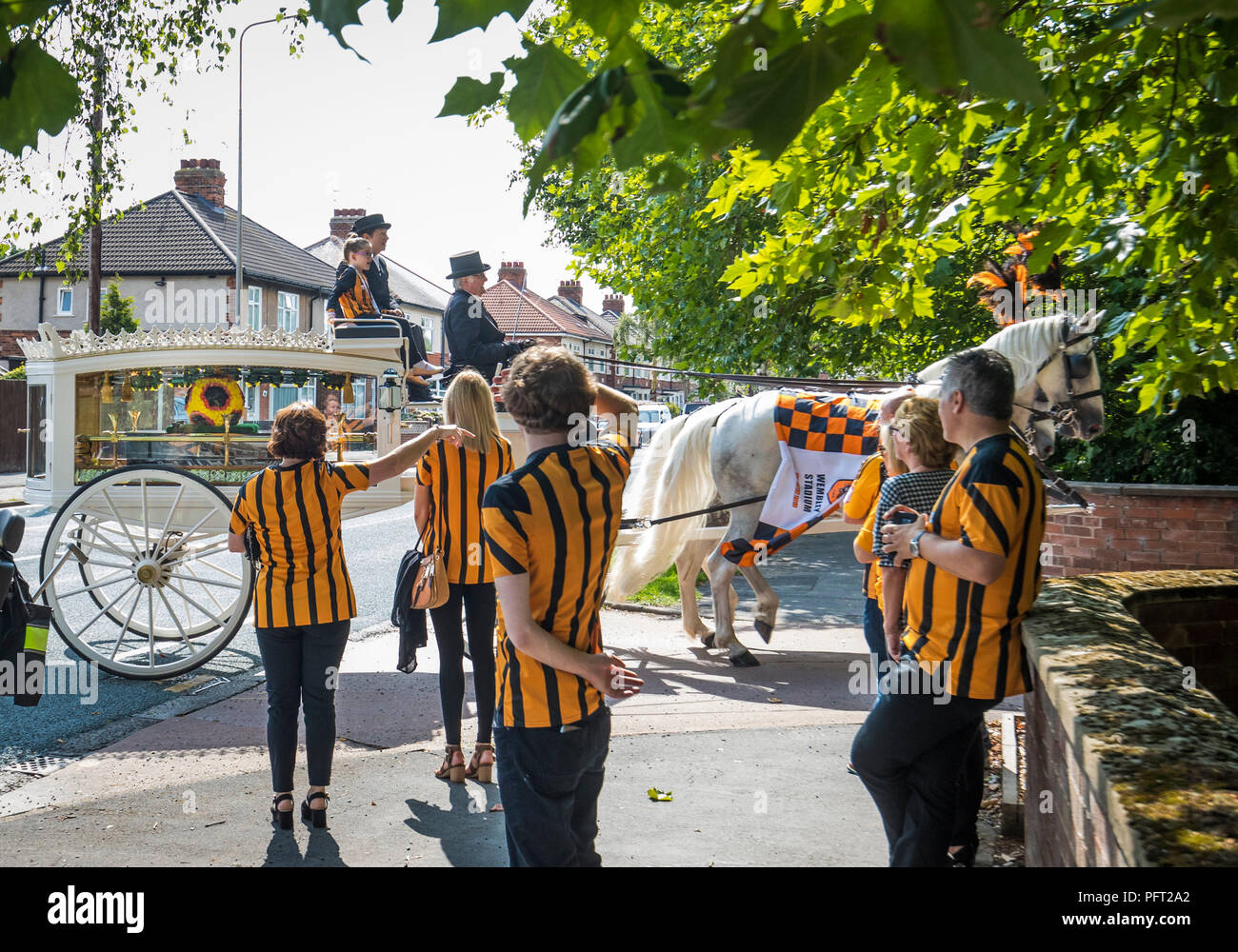 Mourners wearing Hull City shirts arrive at Chanterlands Crematorium in ...