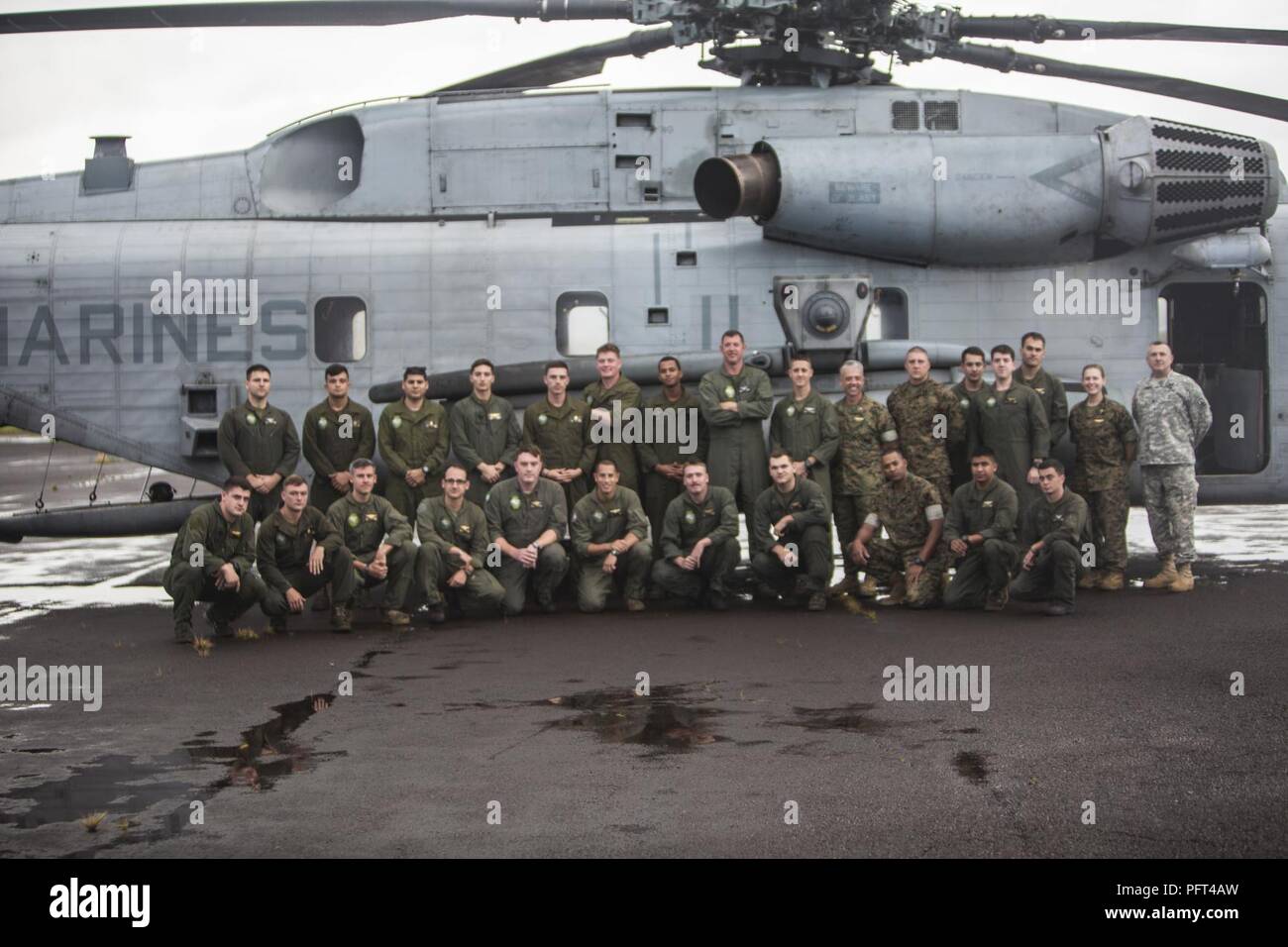 U.S. Marines with Marine Heavy Helicopter Squadron (HMH) 463 pose for a ...