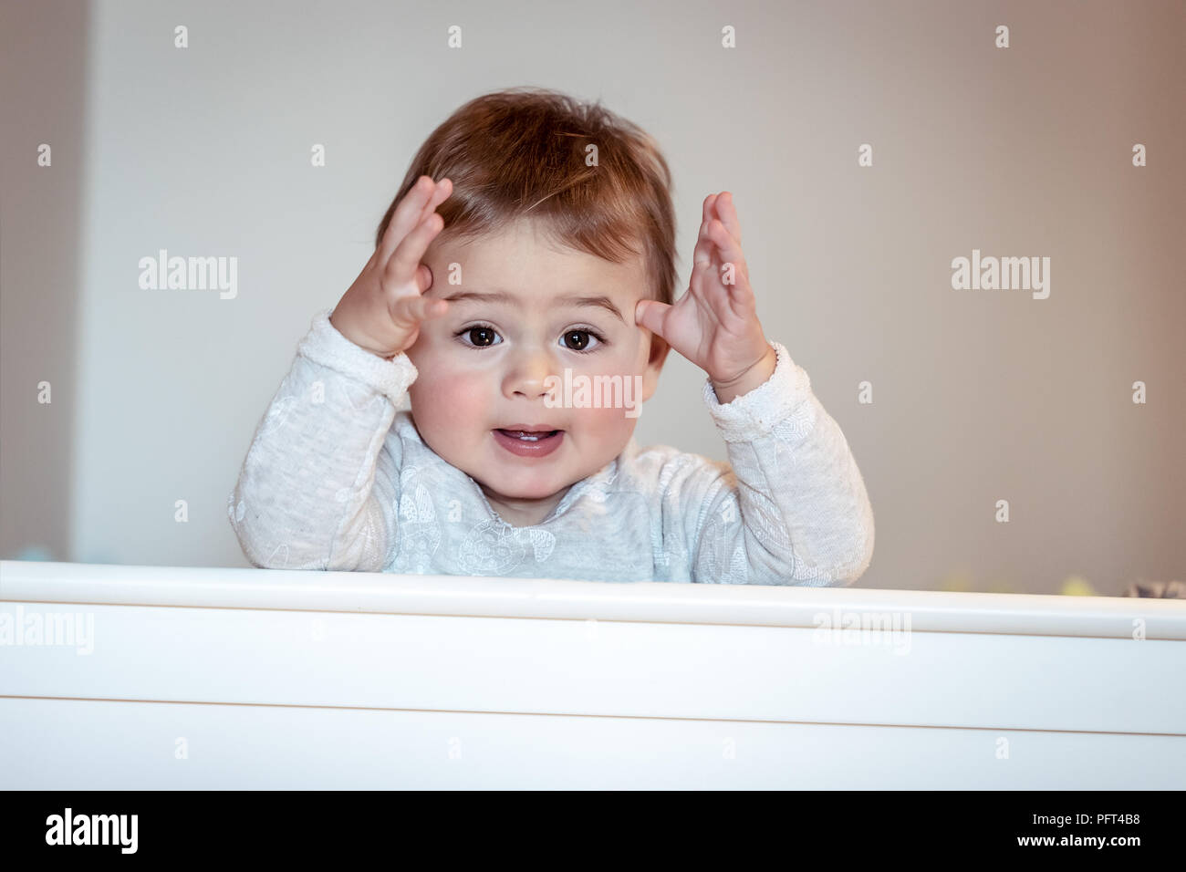 Portrait of a cheerful child having fun and making faces, cute lovely ...
