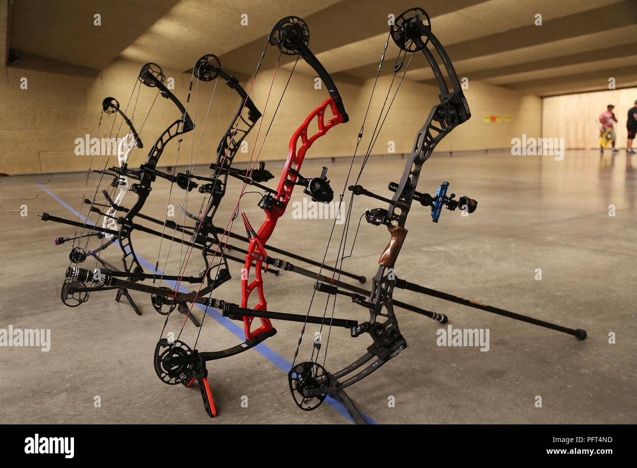Compound bows are stage while Team Army competitors check their targets ...