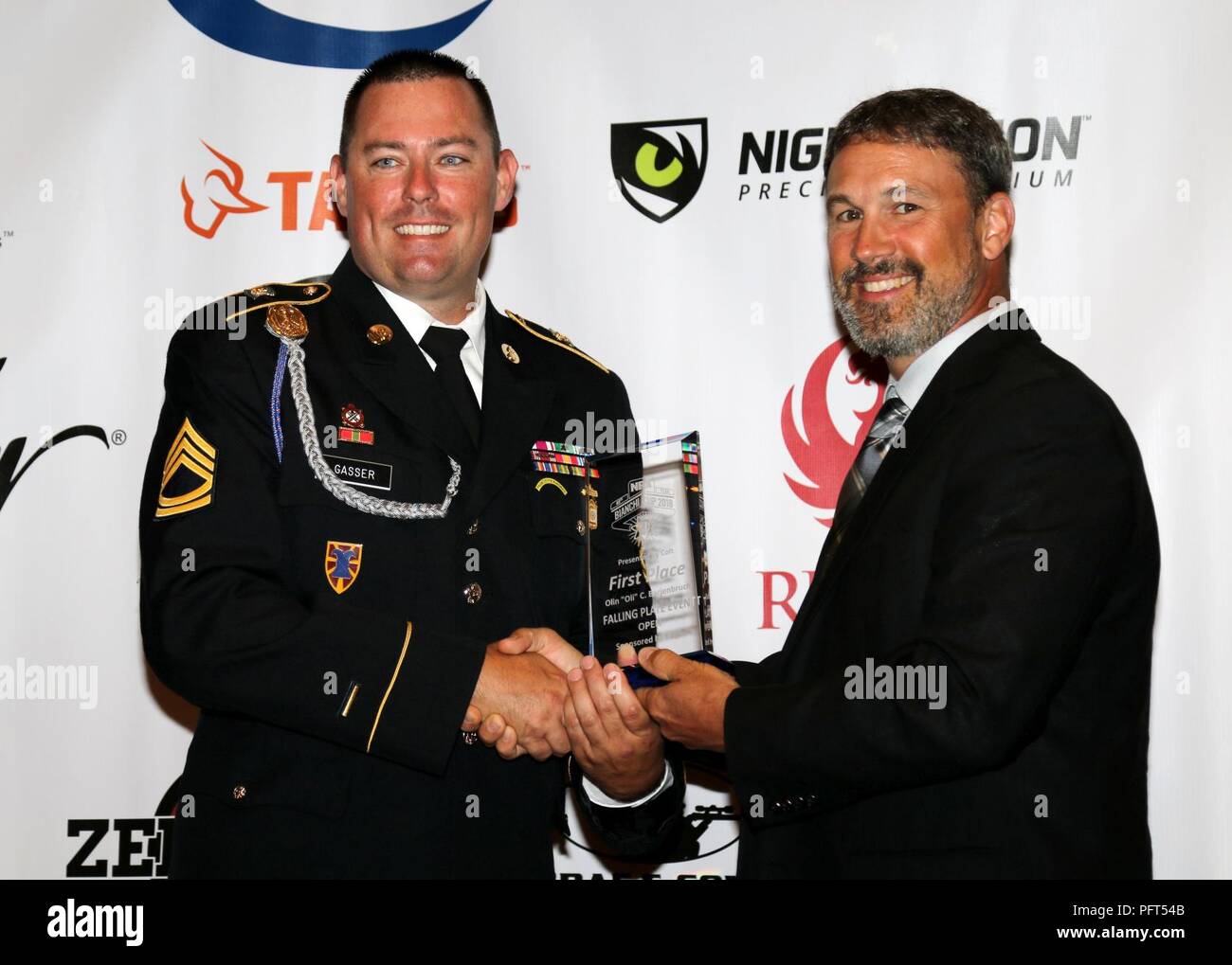 U.S. Army Sgt. 1st Class Michael Gasser accepts his 1st Place in The Falling Plate Event at the ...