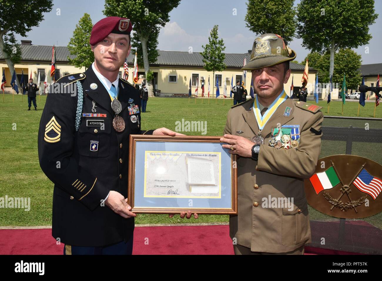 U.S. Army Paratrooper 1st Sgt. Michael J. Atchinson, presents the ...