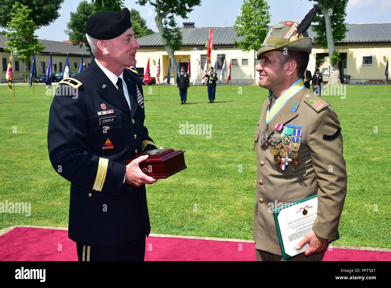 The outgoing Italian Base Command Sgt. Maj. Antonio Quaglia (right ...