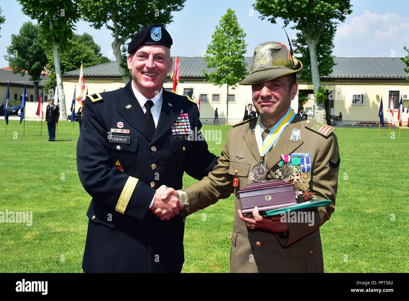 The outgoing Italian Base Command Sgt. Maj. Antonio Quaglia (right ...