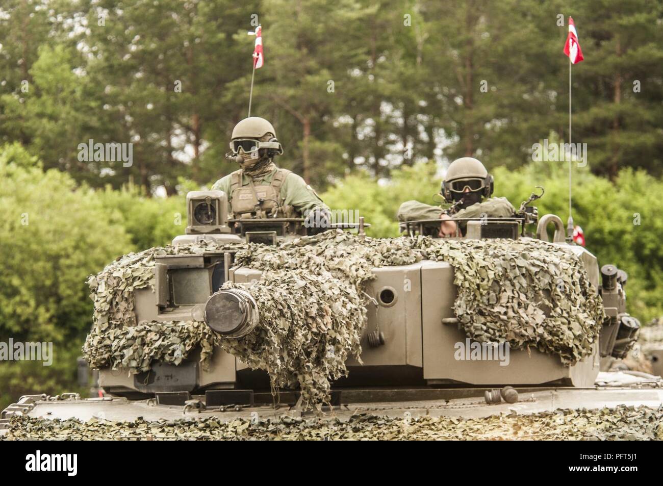 An Austrian Leopard 2A4 tank fires at its target during the calibration ...