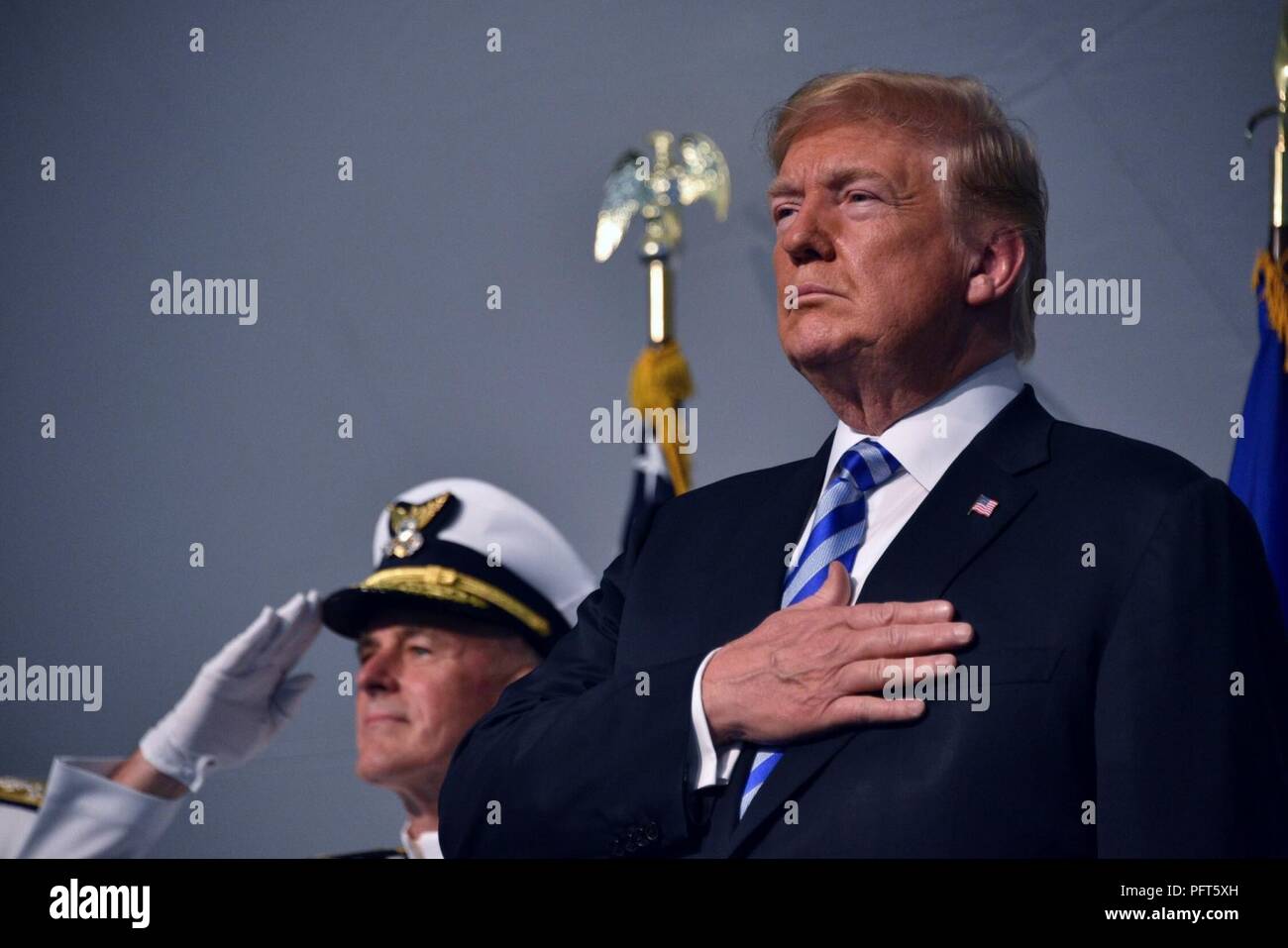 Adm. Paul Zukunft (left) and President Donald Trump render honors ...