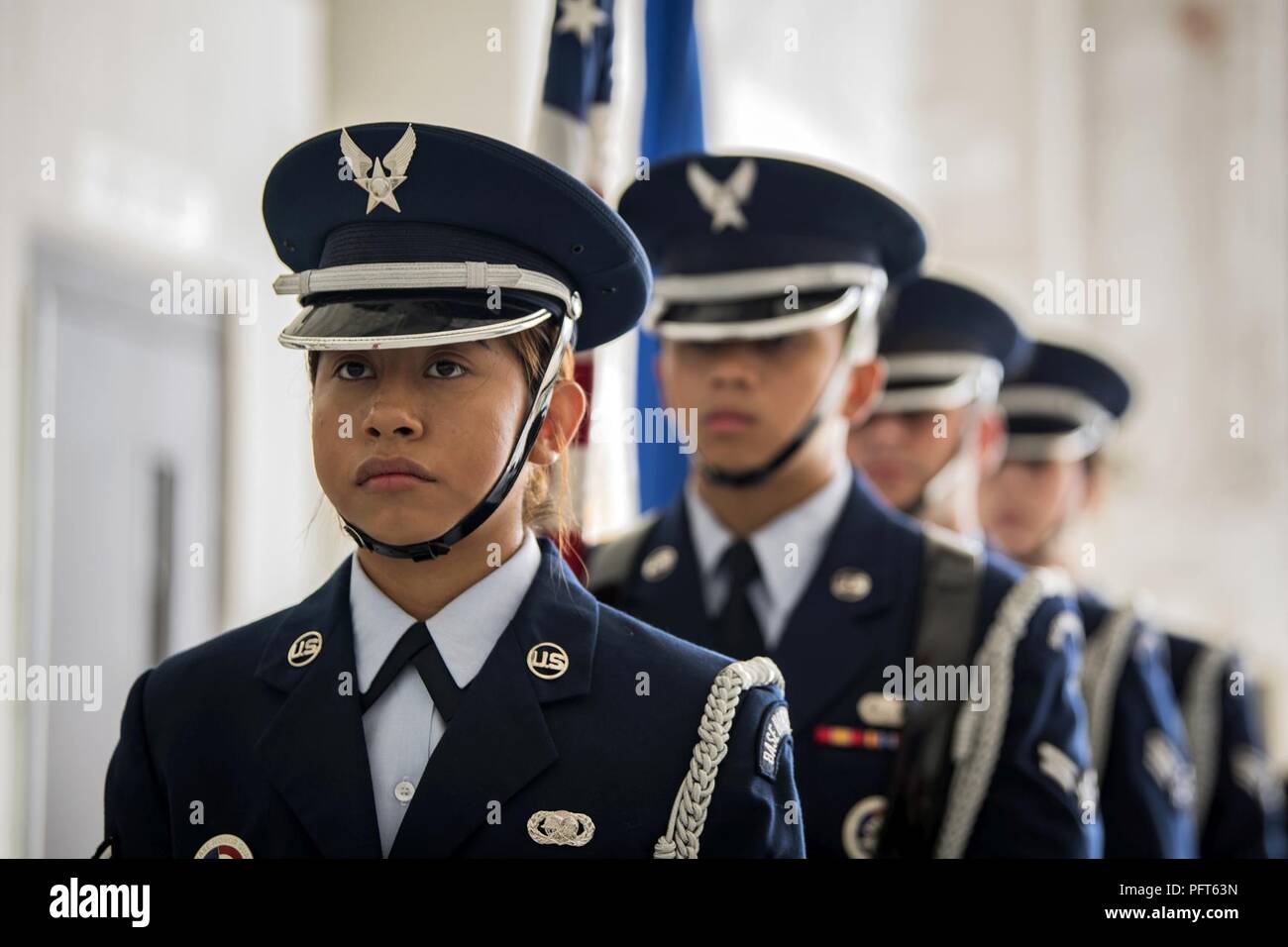 Airmen from the Moody honor guard, stand at attention prior to a change ...