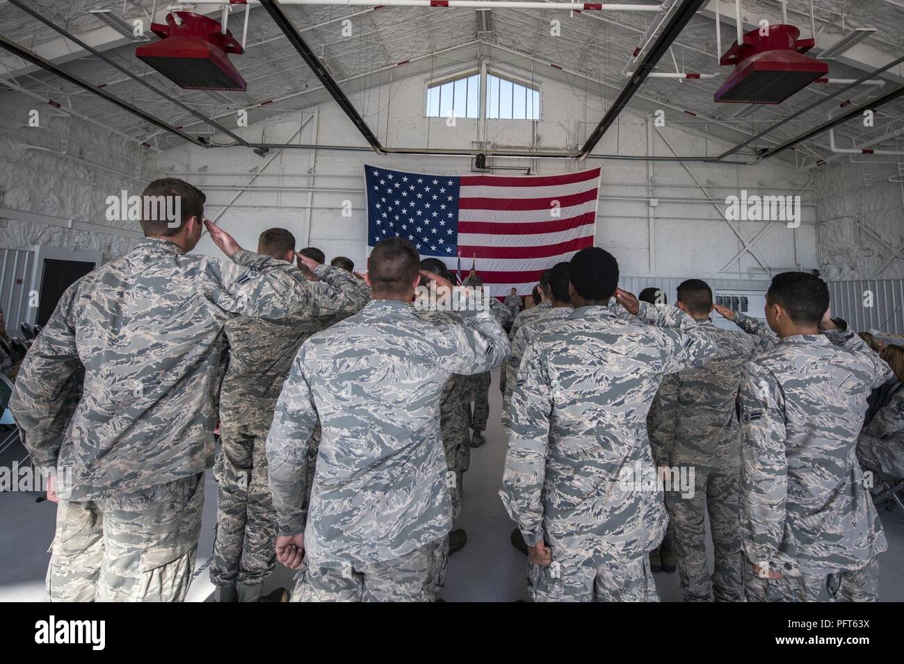 Airmen from the 23d Aircraft Maintenance Squadron (AMXS), salute during ...