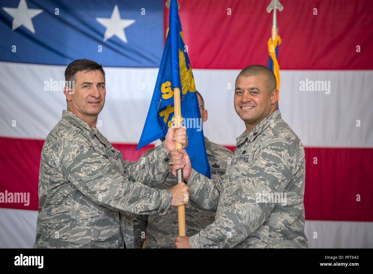 Col. John Chastain, left, 23d Maintenance Group commander, passes the ...