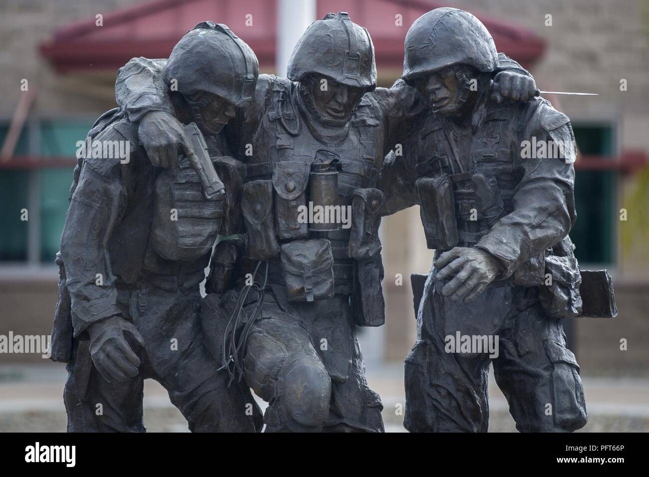 The commemorative statue of 1st Sgt. Bradley Kasal being carried by ...