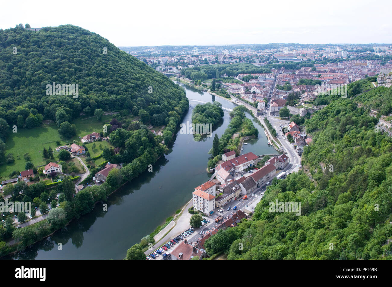 France, Franche-Comte, Besancon, rooftops of city and forested hills on ...