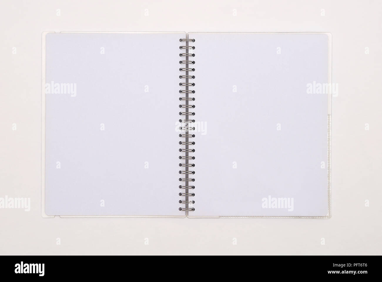 Opened spiral notebook with blank pages Stock Photo - Alamy