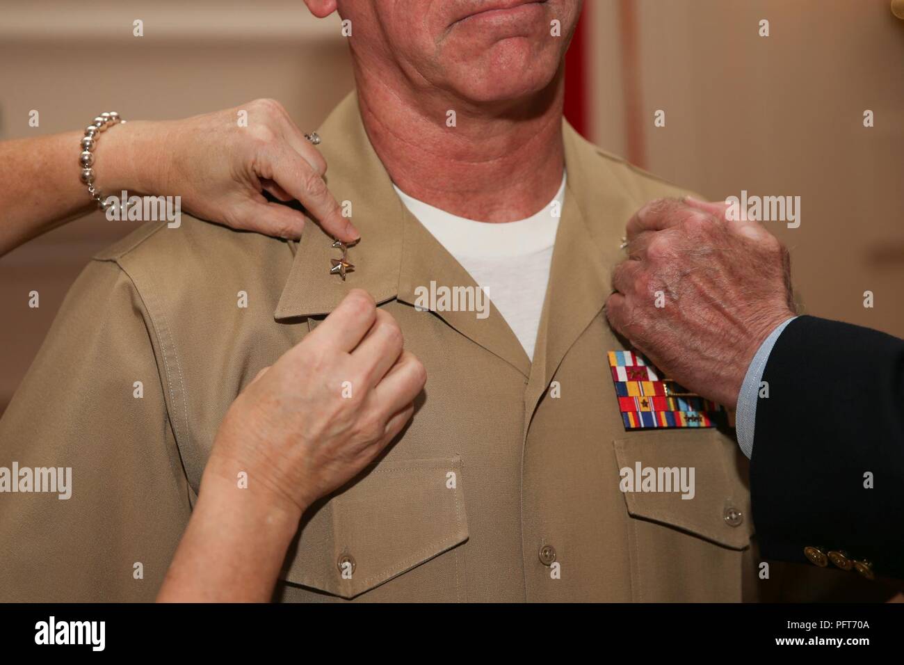 Family members of U.S. Marine Corps Maj. Gen. David Ottignon, inspector ...
