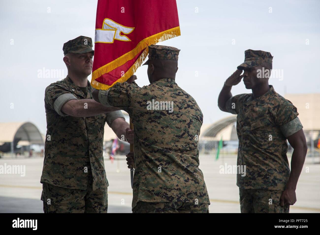 U.S. Marine Corps Lt. Col. Jabari J. Reneau, center, outgoing ...
