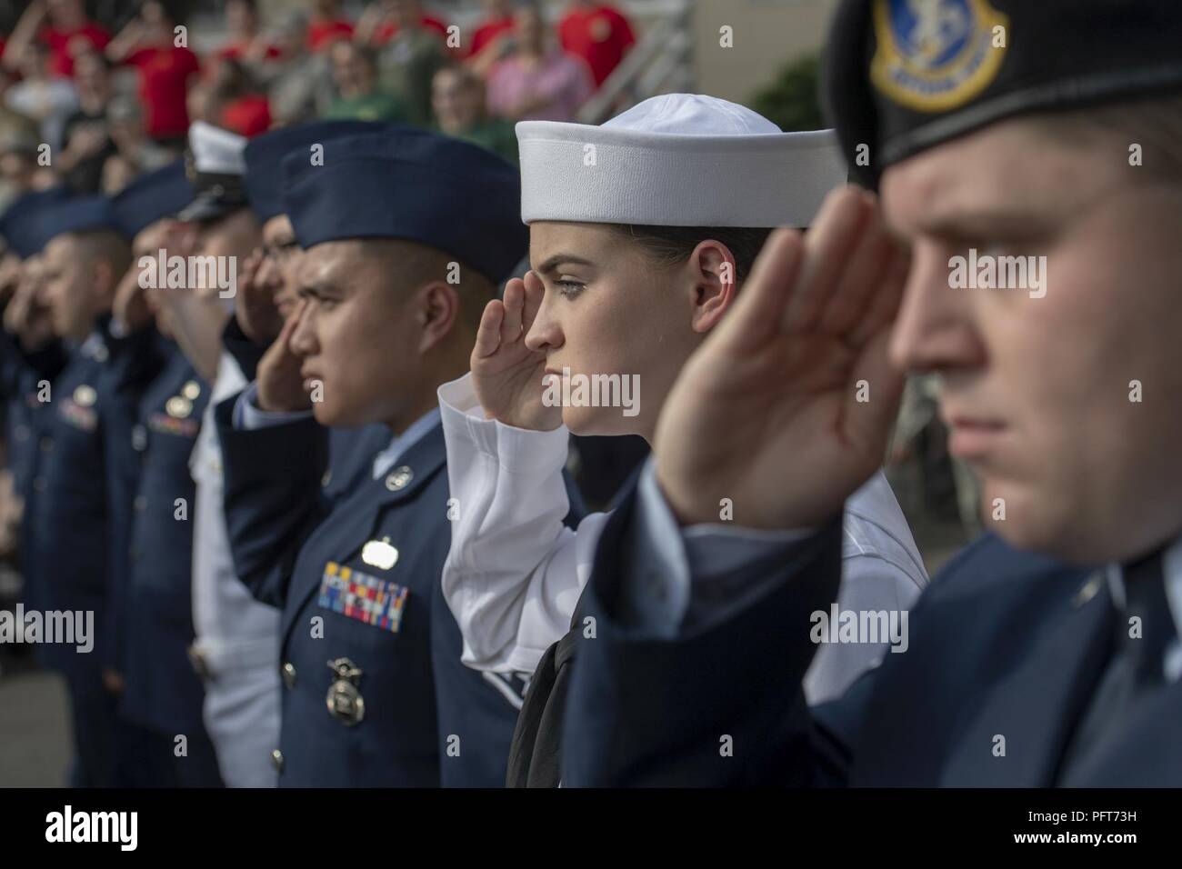Service members salute during a ceremony for Memorial Day at Yokota Air ...