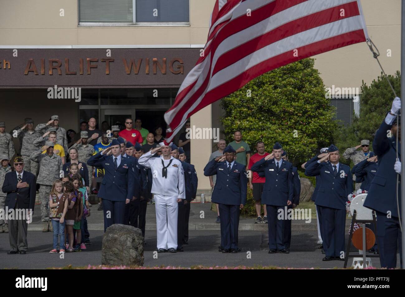 Service members salute during a ceremony for Memorial Day at Yokota Air ...