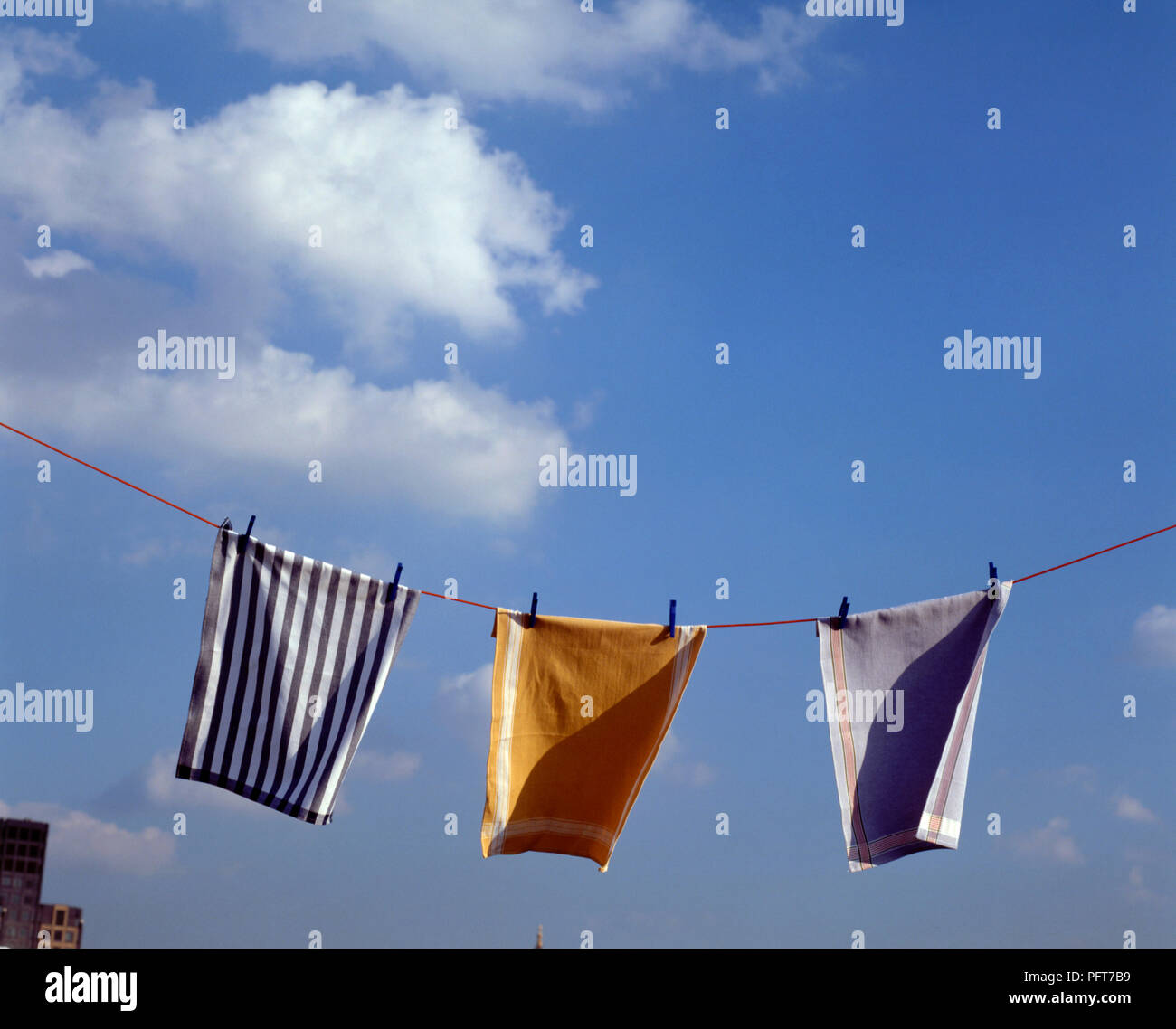 Three towels on a washing line Stock Photo - Alamy
