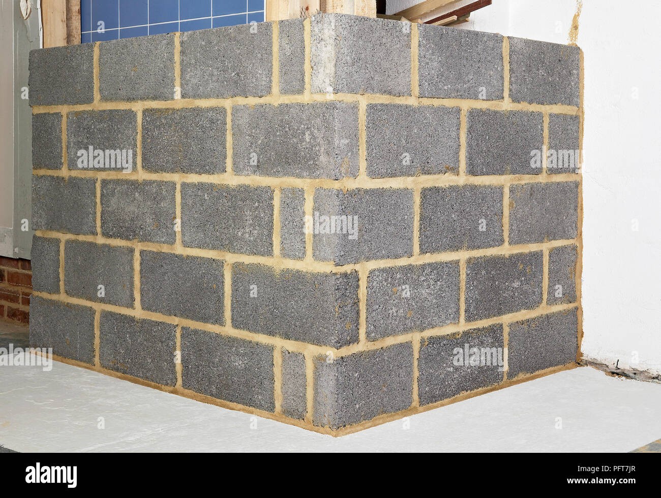 Corner of a solid block wall Stock Photo - Alamy