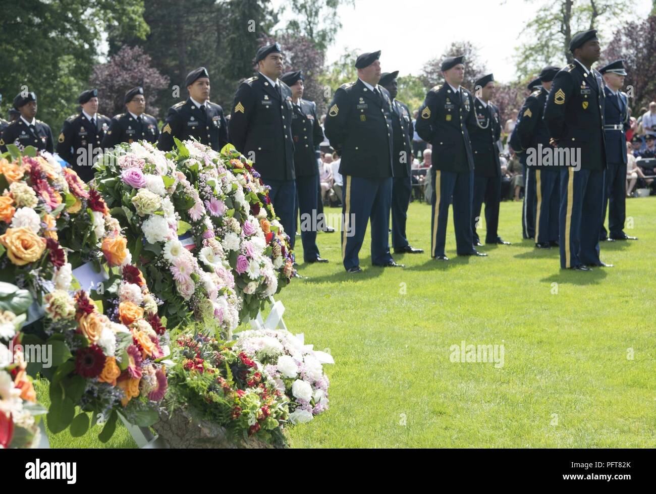 U.S. Soldiers and Airmen stand in honor formation during a Memorial Day ...