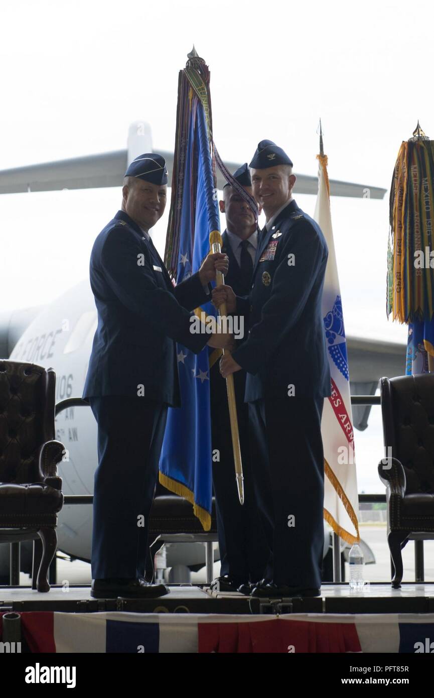 Lt. Gen. Giovanni Tuck, 18th Air Force commander, left, passes the 62nd ...