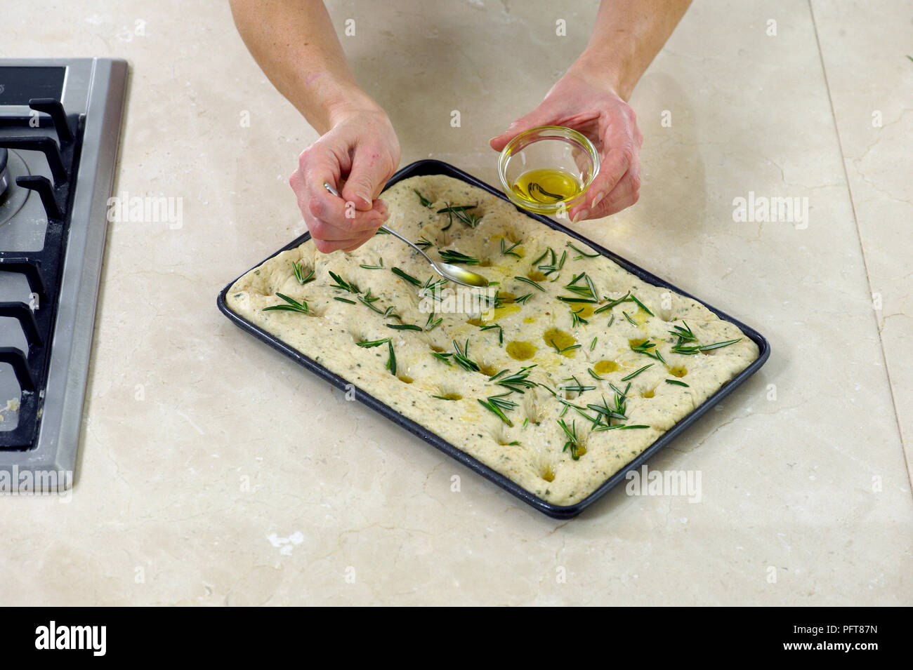 Man putting olive oil hi-res stock photography and images - Alamy