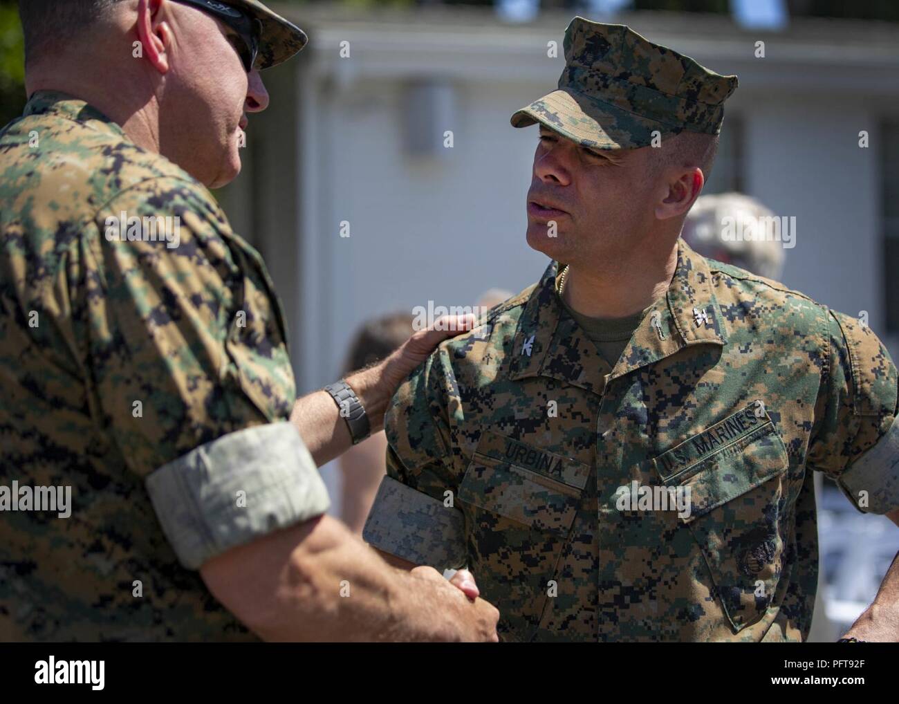 U.S. Marine Corps Col. Carlos O. Urbina, right, the commanding officer ...