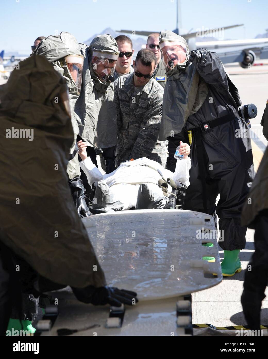 Members of the 161st Air Refueling Wing receive a patient to process ...