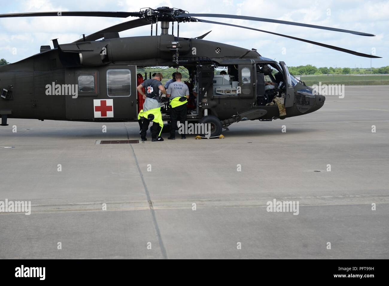 Soldiers from the Texas National Guard and rescue swimmers prepare for ...