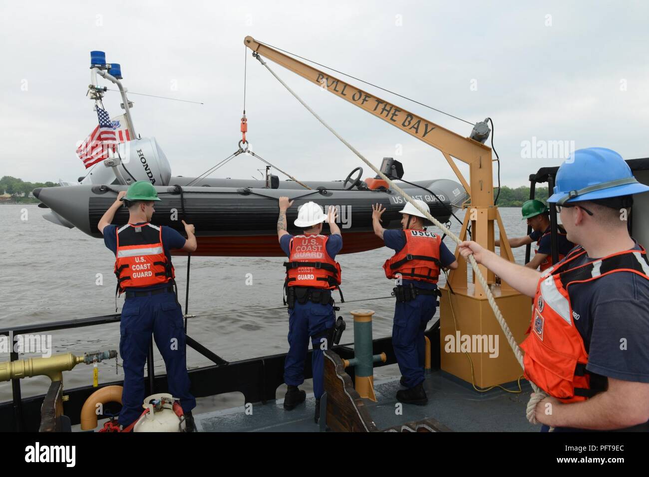 U.S. Coast Guard Cutter Chock crew members in the process of launching ...