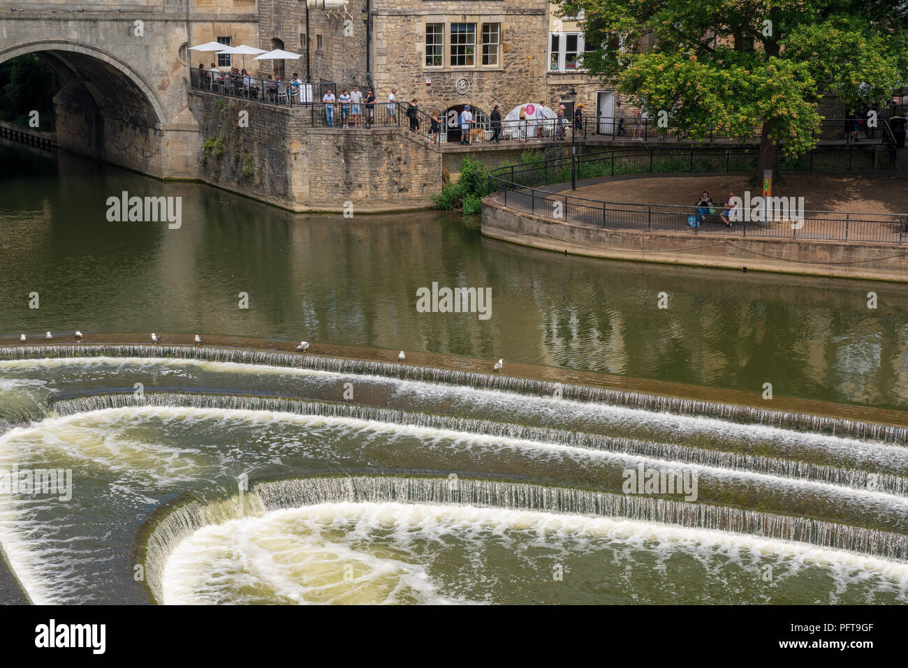 Pulteney Weir, near Pulteney Bridge, is a popular tourist destination ...