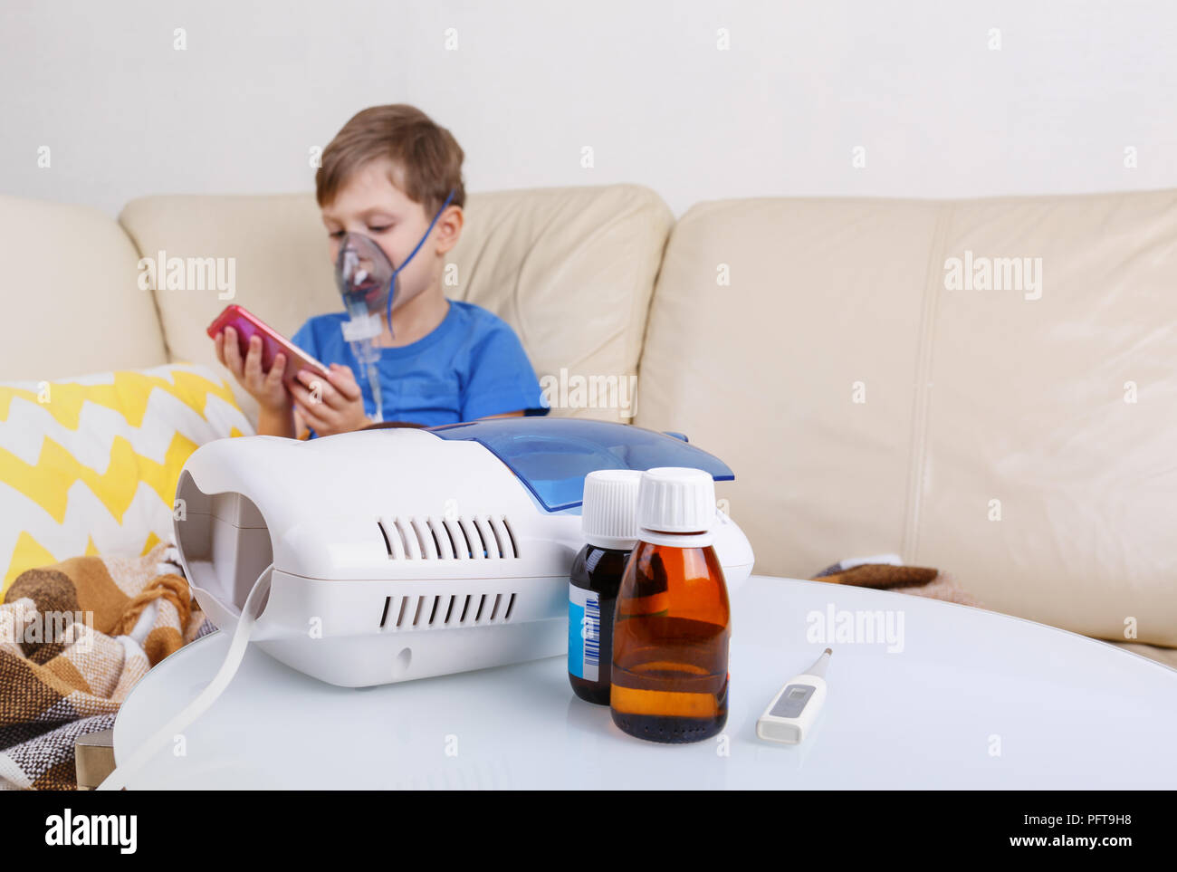 Boy breathe through nebulizer. Sick chid with pediatric nebulizer Stock ...