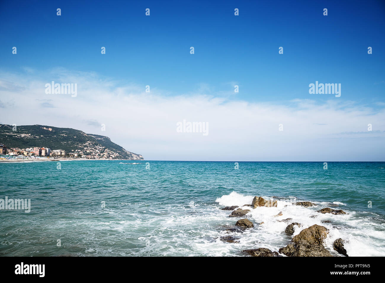 Beautiful seascape. Pebble beach and clear blue water. Summer beach ...