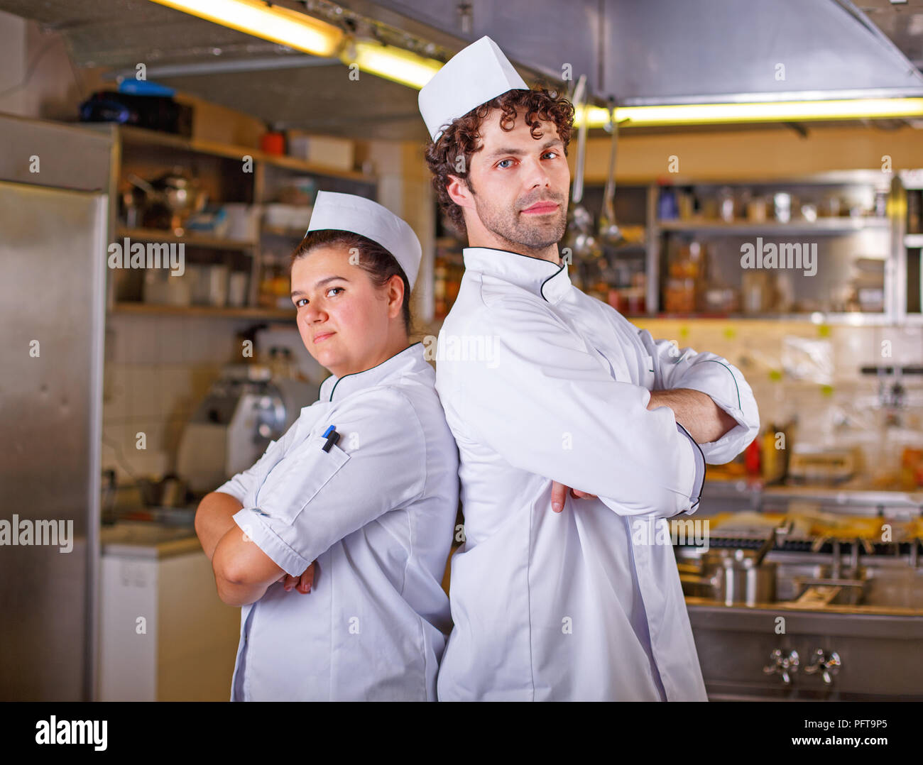 Two chefs cook together. Cooking process concept Stock Photo - Alamy