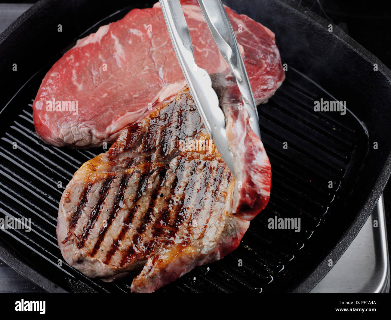 Steak griddle tongs hi-res stock photography and images - Alamy