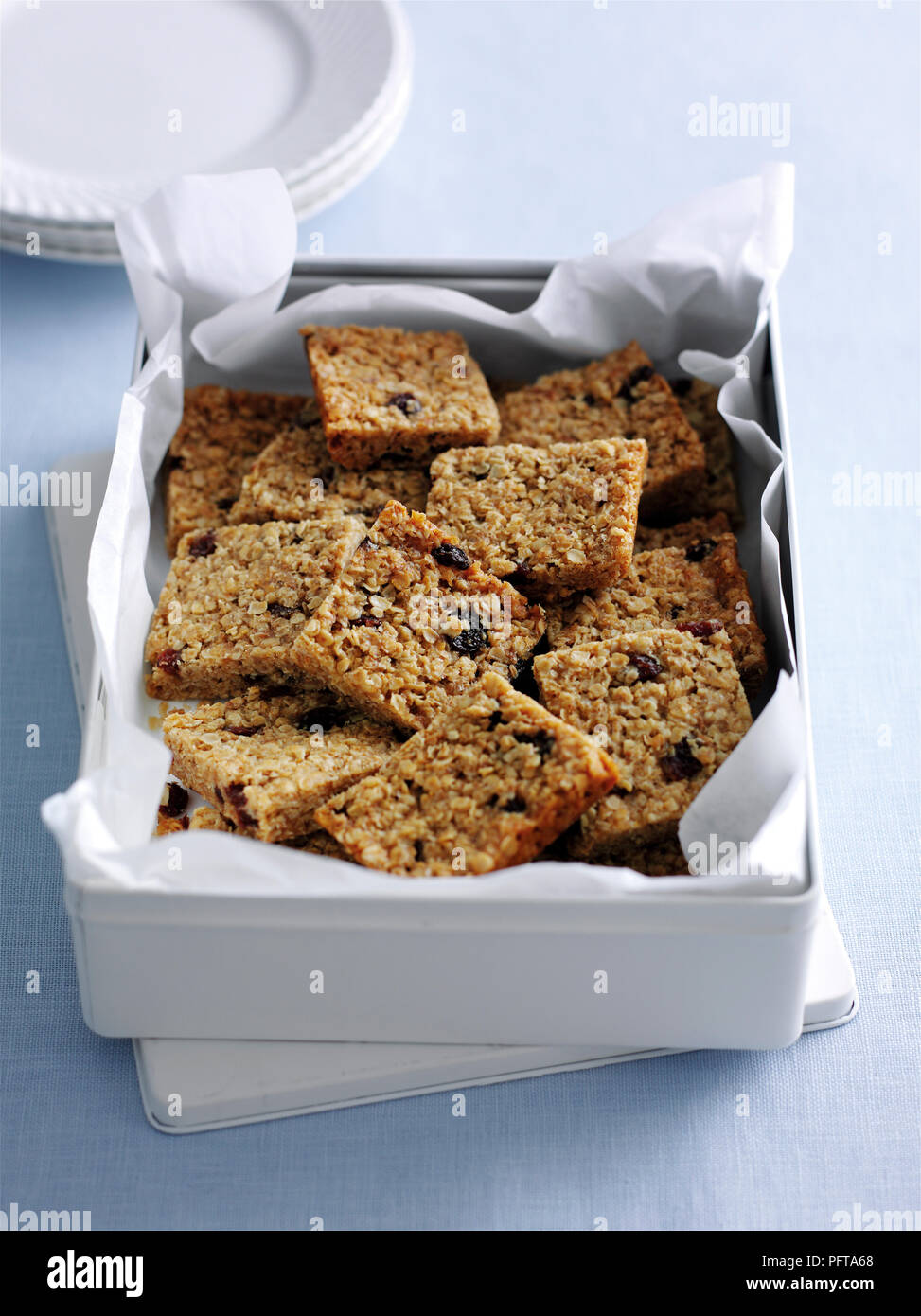 Sultana flapjacks in box lined with paper Stock Photo - Alamy