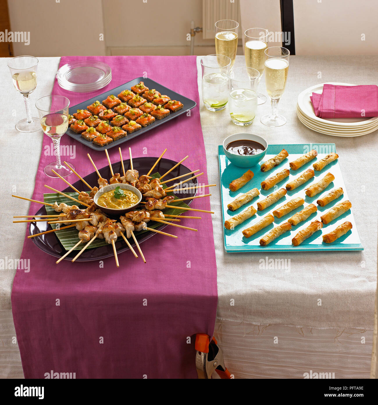 Finger food buffet, chicken satays, salmon on rye, duck and hoisin ...