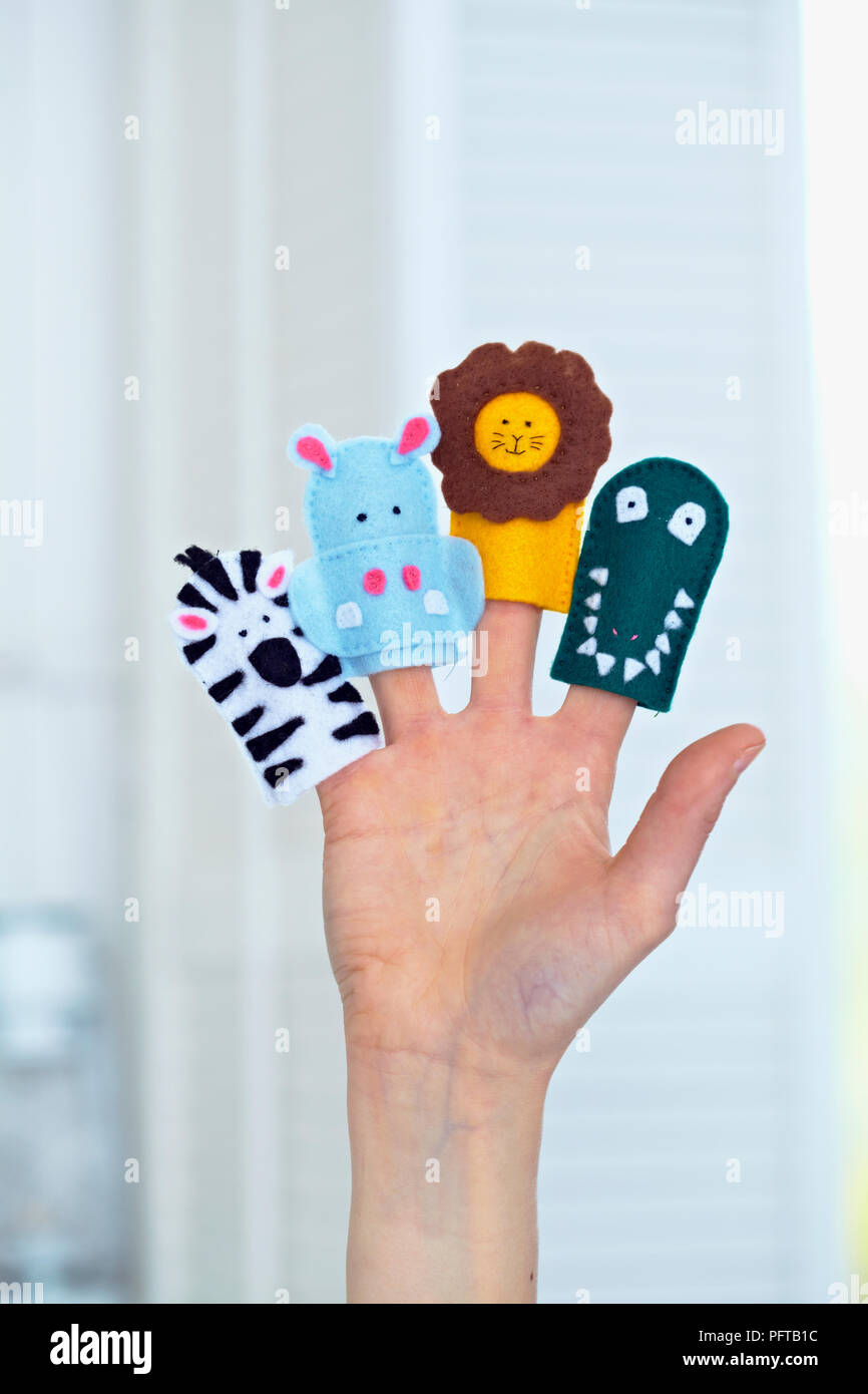 Finger puppets on hand Stock Photo - Alamy