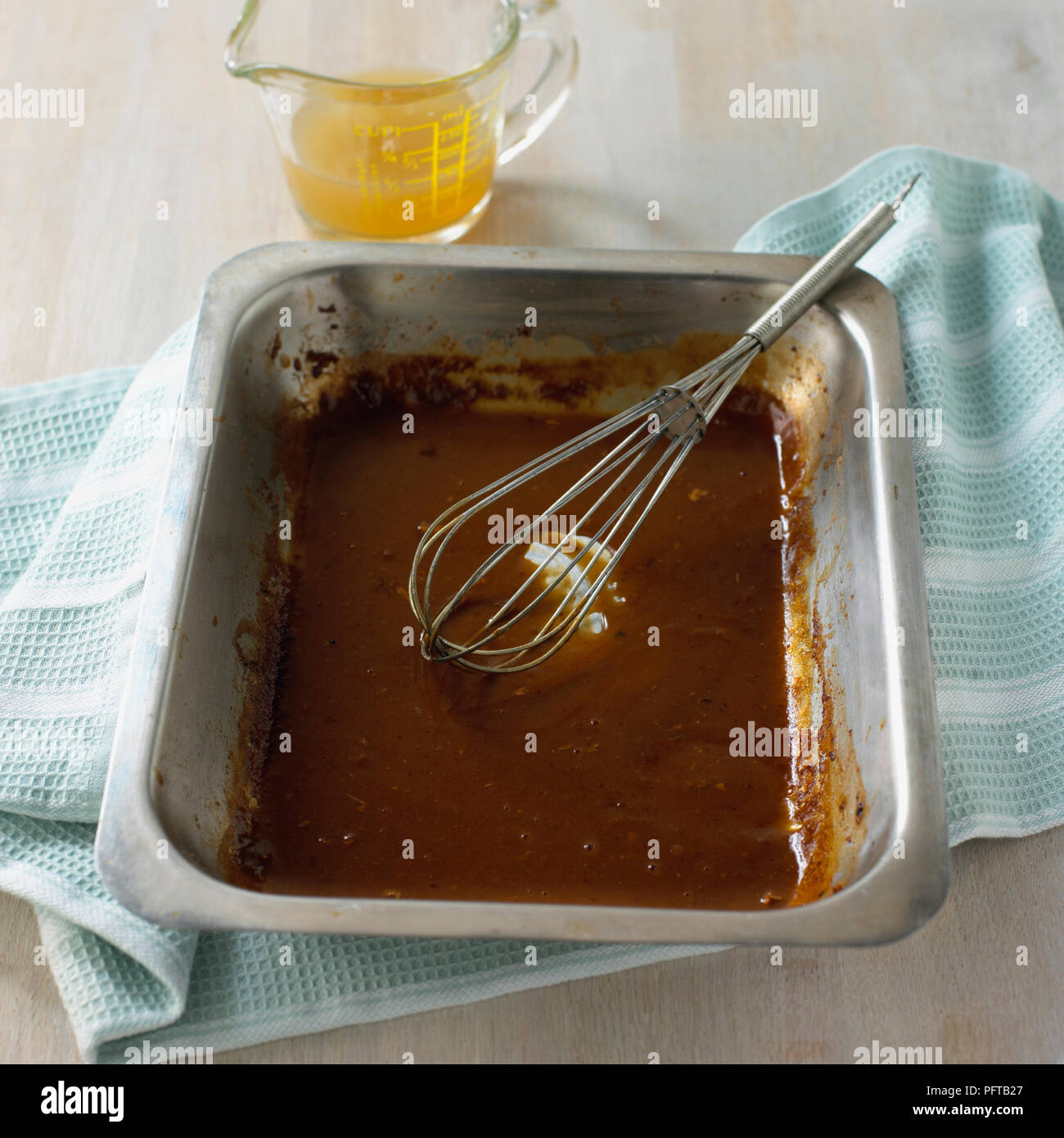 Making pan gravy Stock Photo - Alamy