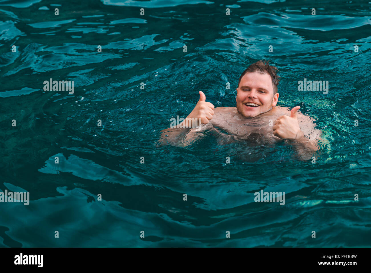 man swimming in blue transparent sea water. summer vacation Stock Photo ...