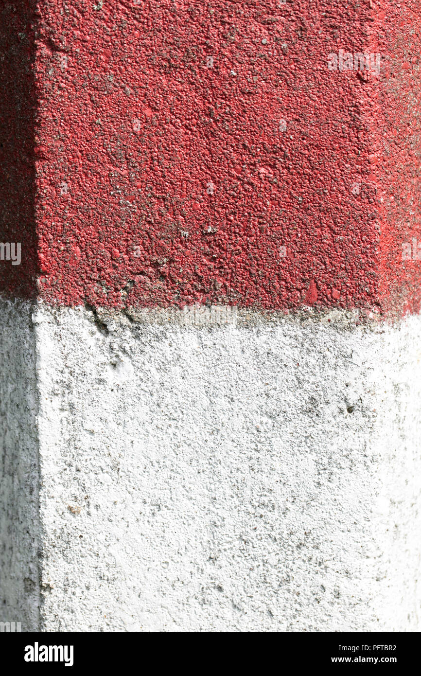 cement block painted red and white Stock Photo - Alamy