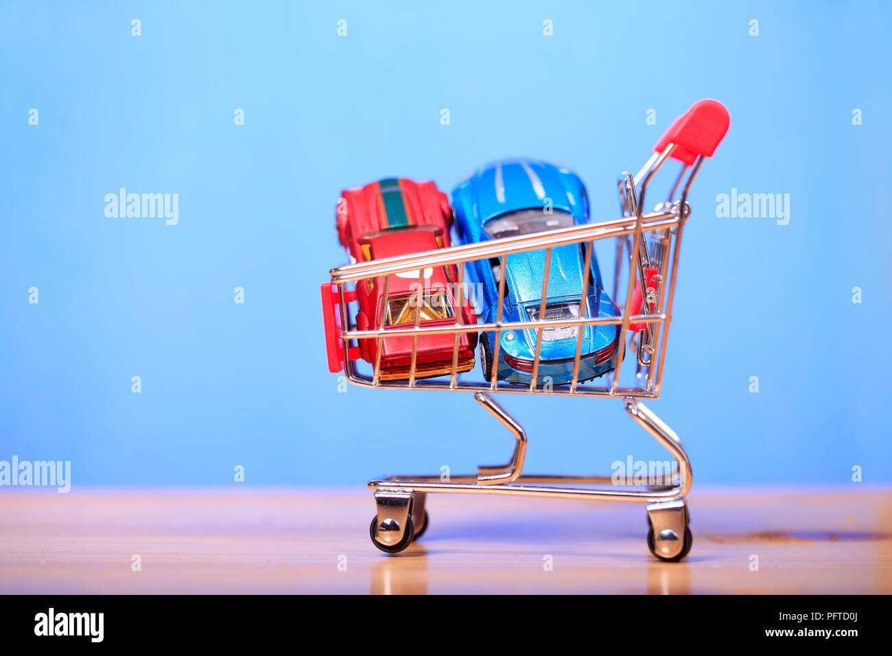 Car shopping, The car model in the shopping cart Stock Photo - Alamy