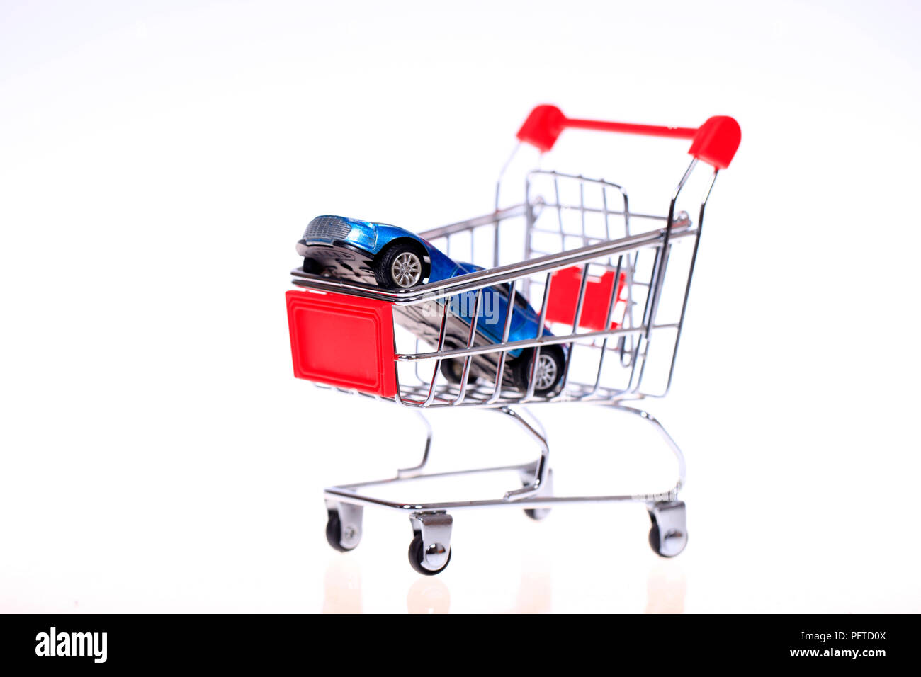 Car shopping, The car model in the shopping cart Stock Photo - Alamy