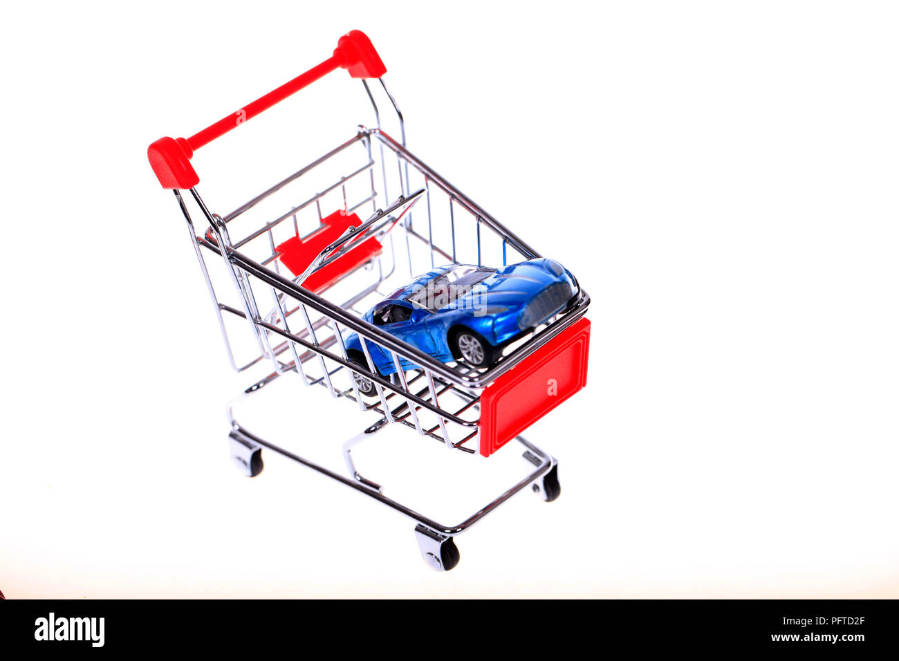 Car shopping, The car model in the shopping cart Stock Photo - Alamy
