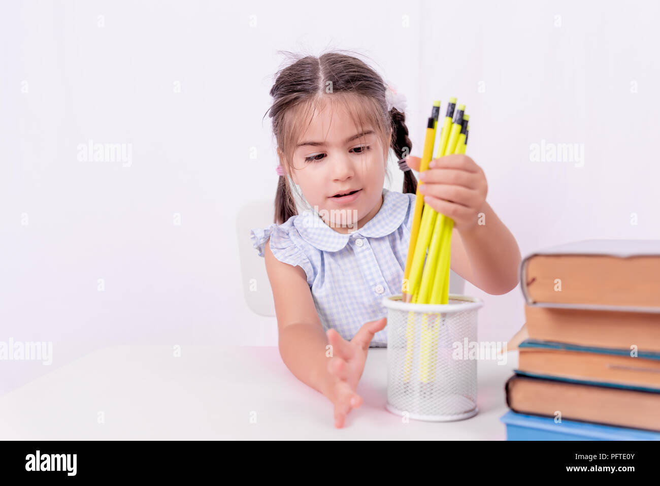 Primary student with pencil hi-res stock photography and images - Alamy