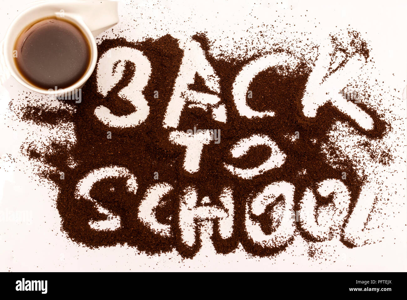 Back to school on of ground coffee background Stock Photo - Alamy