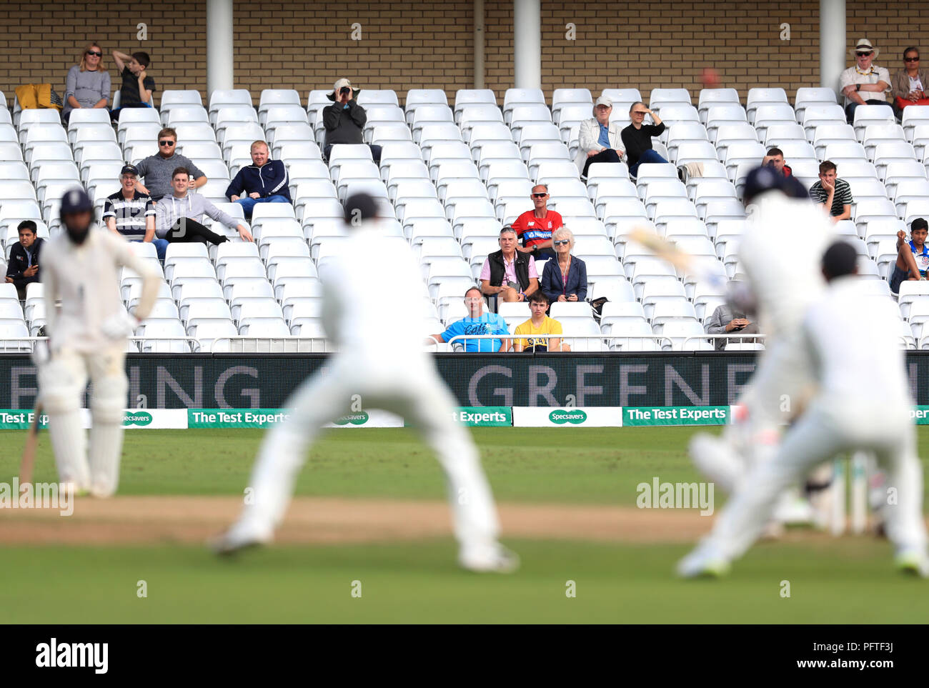Spectators watch the match action during day five of the Specsavers ...
