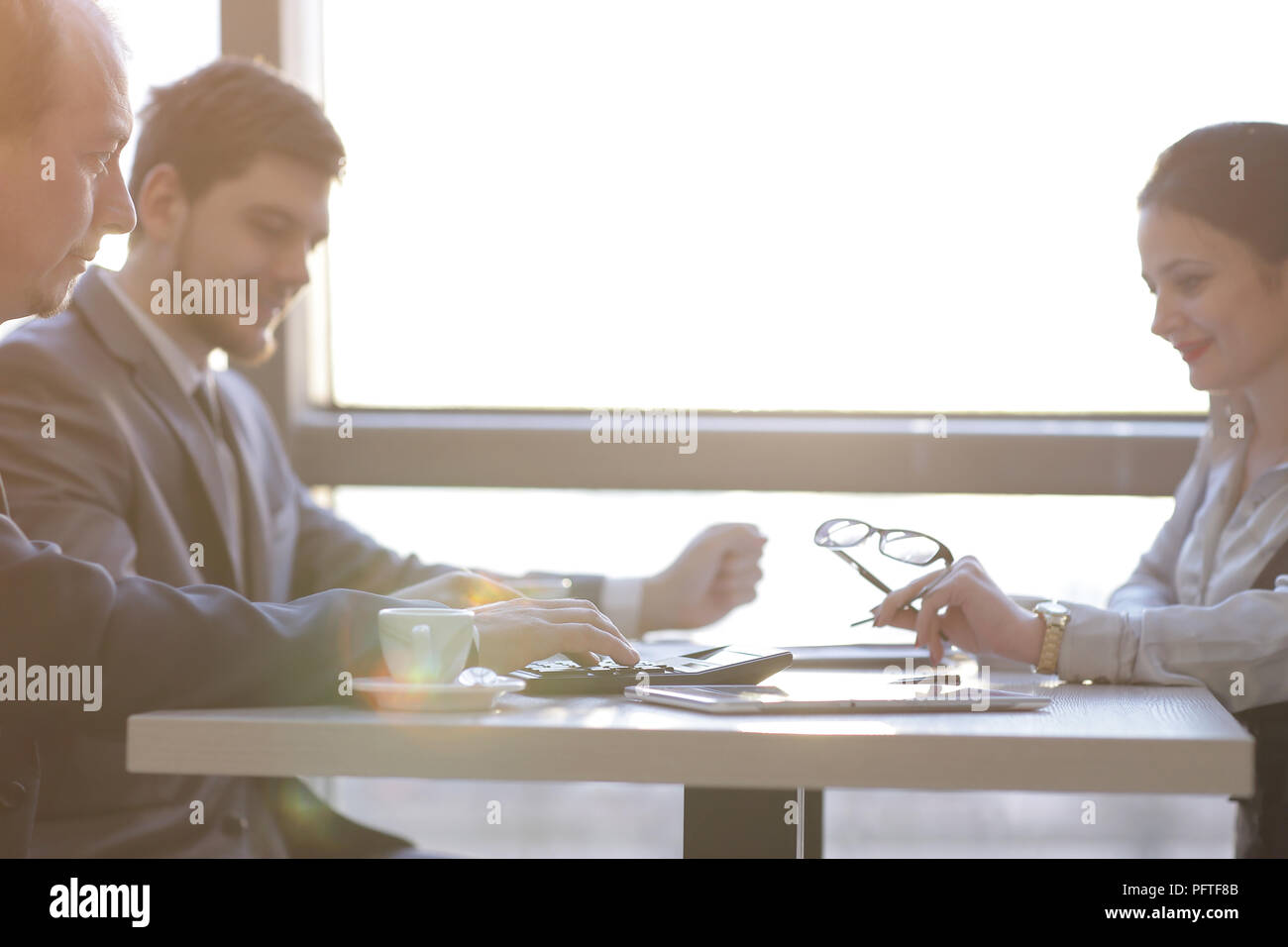 Team businessman using calculator hi-res stock photography and images ...